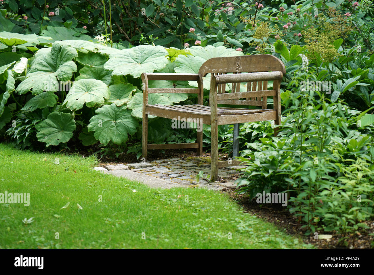 Park bench in a Bavarian park to relax and rest Stock Photo - Alamy