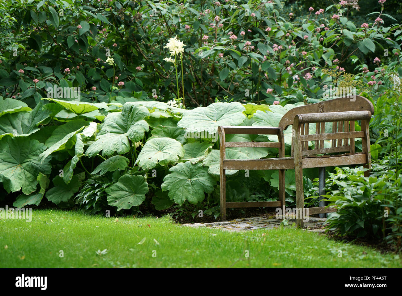 Park bench in a Bavarian park to relax and rest Stock Photo - Alamy