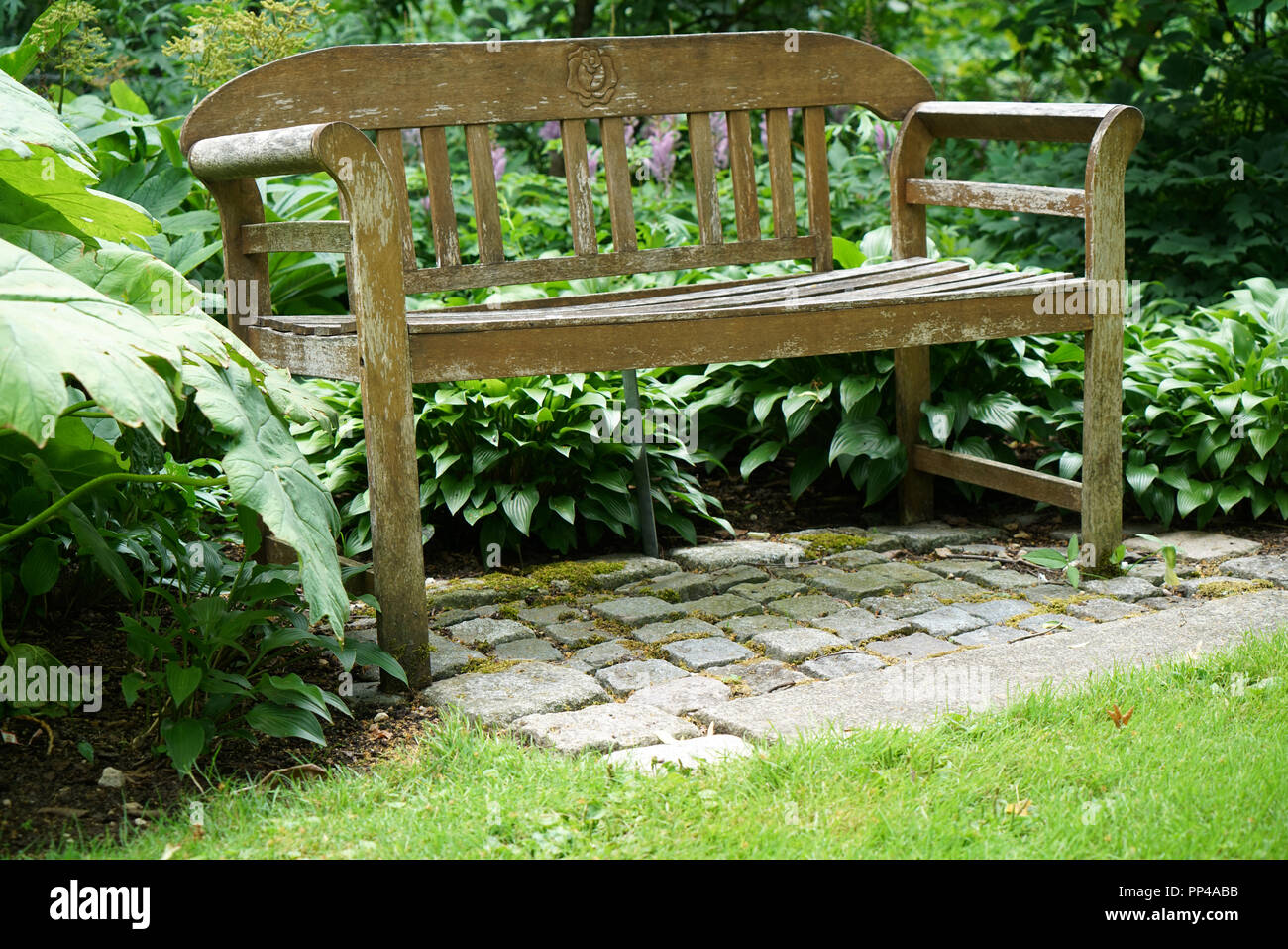 Park bench in a Bavarian park to relax and rest Stock Photo - Alamy