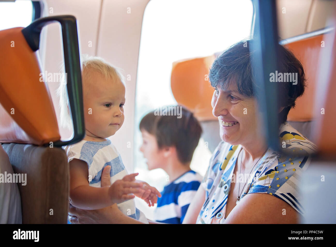 Baby on train seat hi-res stock photography and images - Alamy