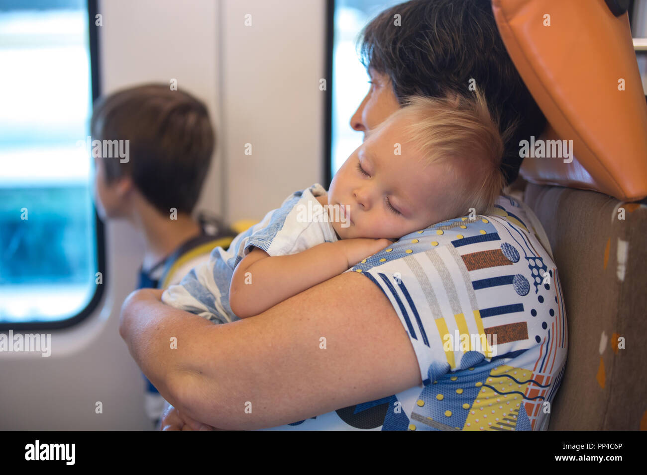 Baby on train seat hi-res stock photography and images - Alamy