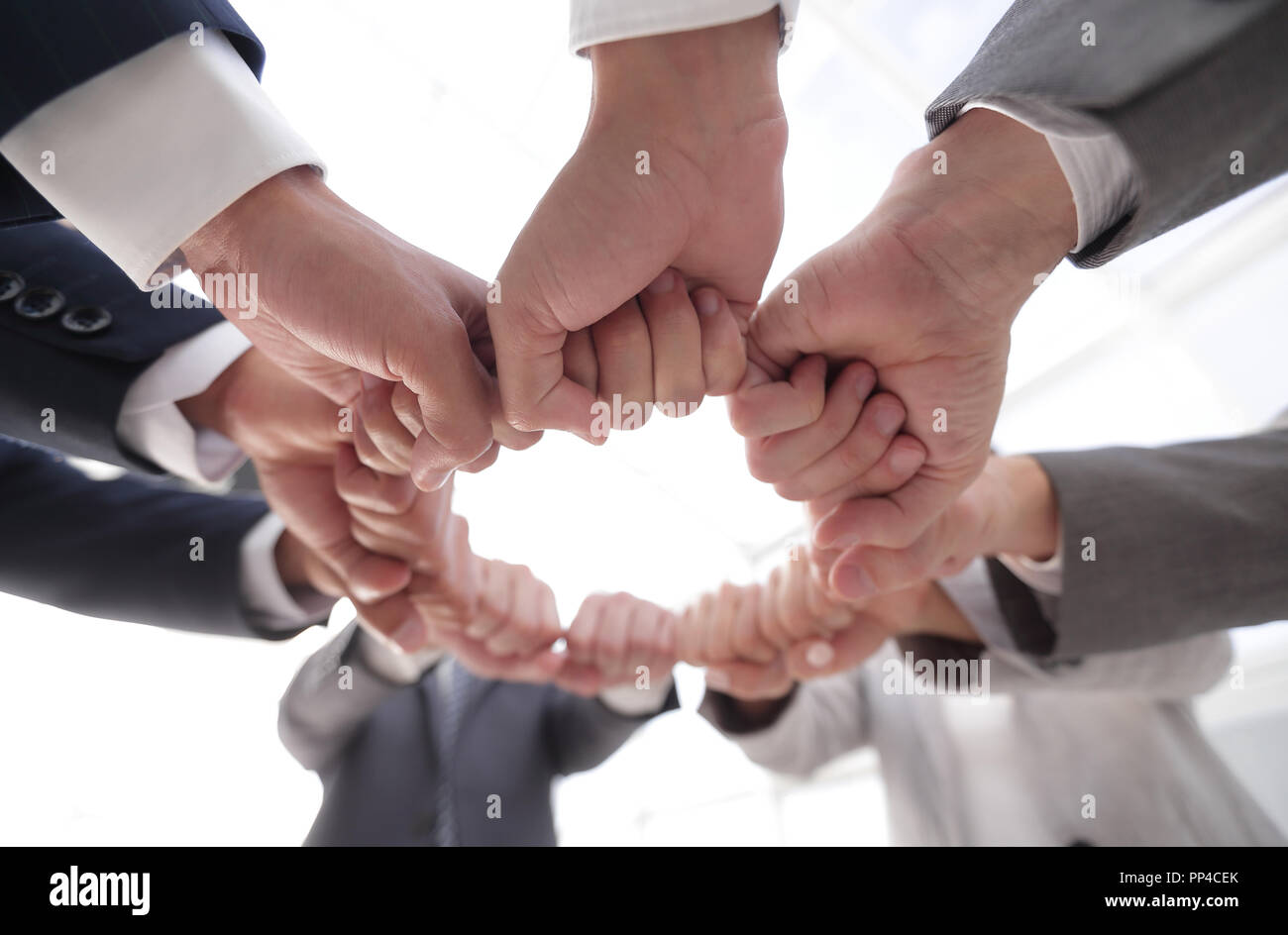 group of people joined their hands Stock Photo - Alamy