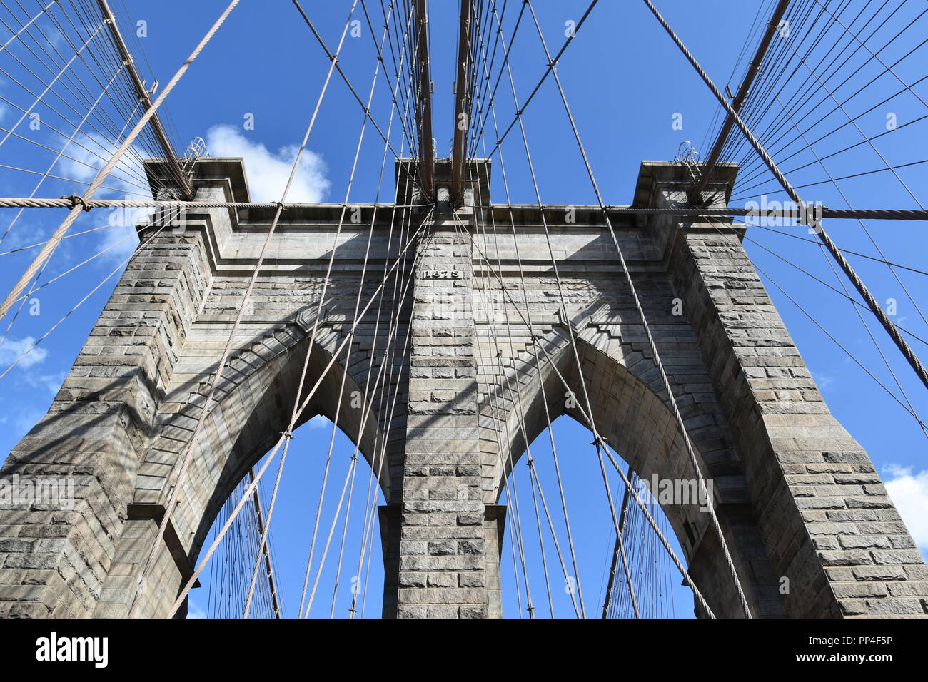 The iconic Brooklyn Bridge spanning the East River between Lower ... The iconic Brooklyn Bridge spanning the East River between Lower ...