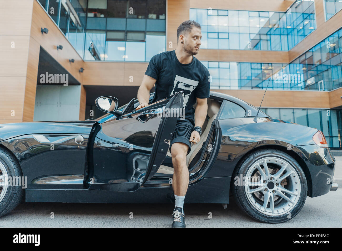 Guy Stepping Out Of Car