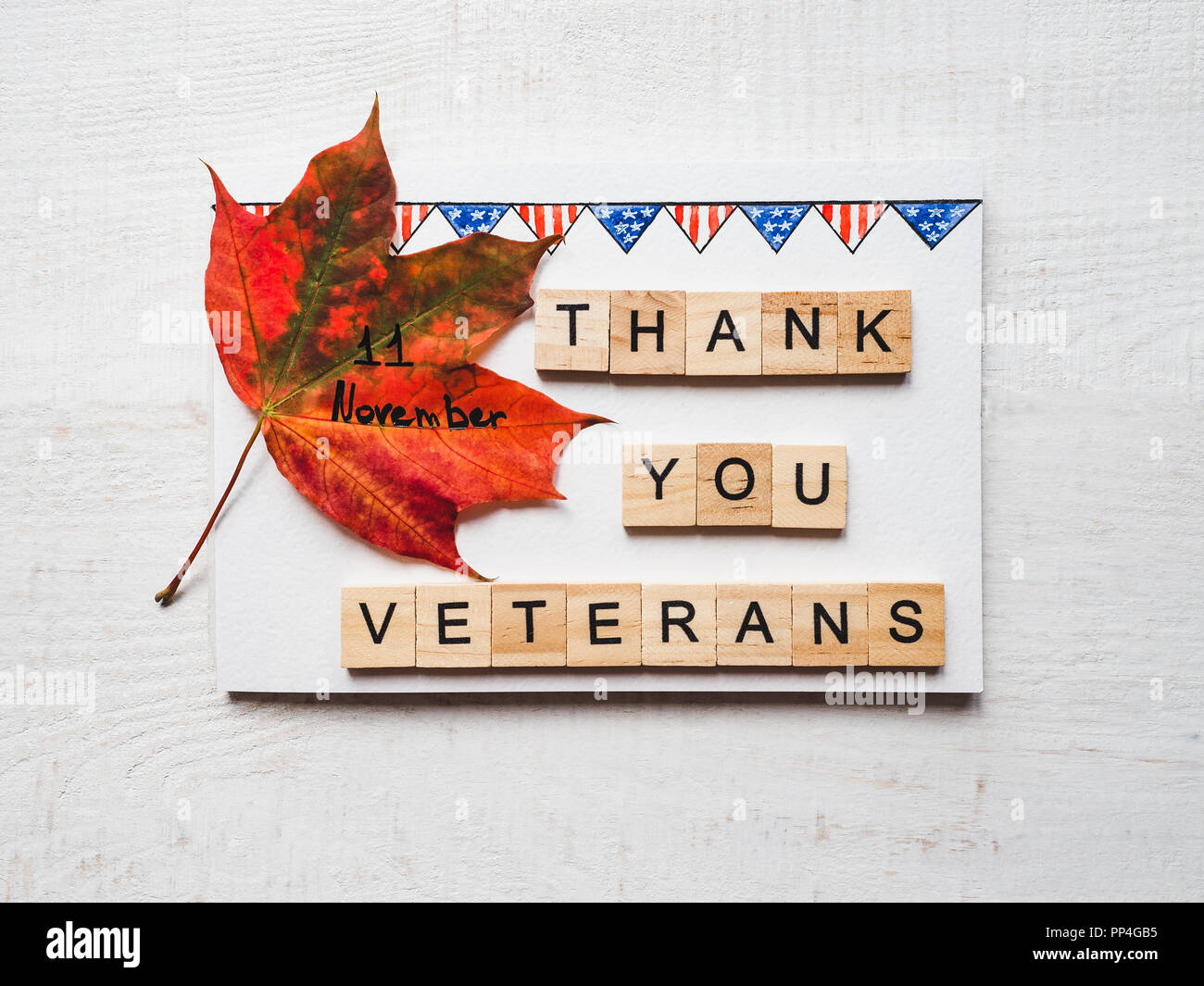 Beautiful greeting card on Veterans Day. Top view, close-up, isolated ...