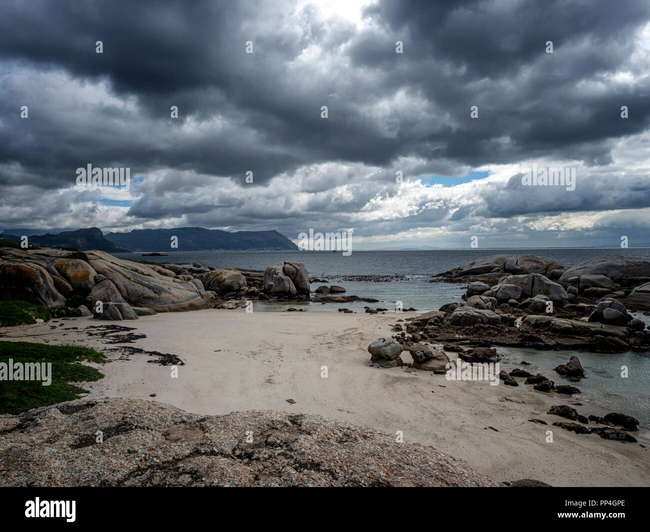 Sandy beaches and boulders on the shores of False Bay, near Cape Town ...