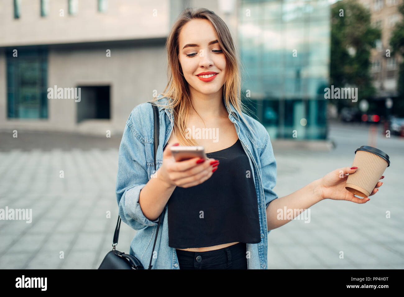 Phone addiction, addict woman holds gadget and coffee in hands, social ...