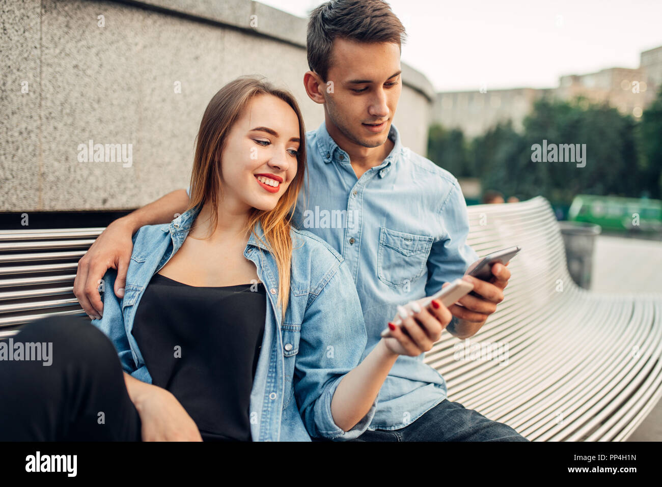 Phone addiction, portrait of addict couple using smartphones on the ...