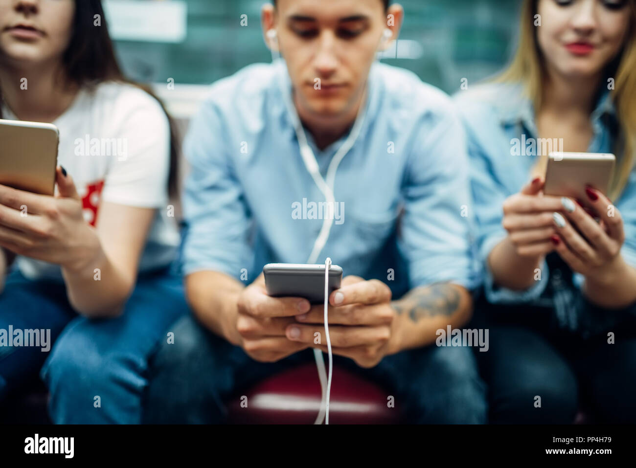 Group of people using phones subway hi-res stock photography and images ...