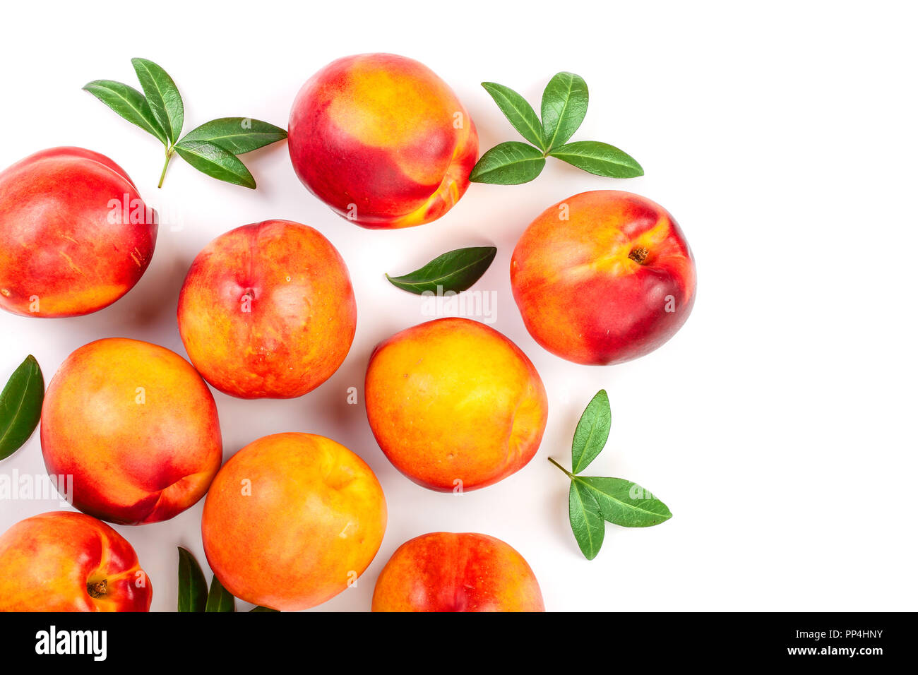 ripe nectarine with leaves isolated on white background with copy space ...