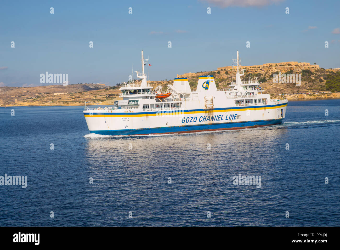 City Gozo, Malta, Europe. Big boat and water, urban view. Water and ...