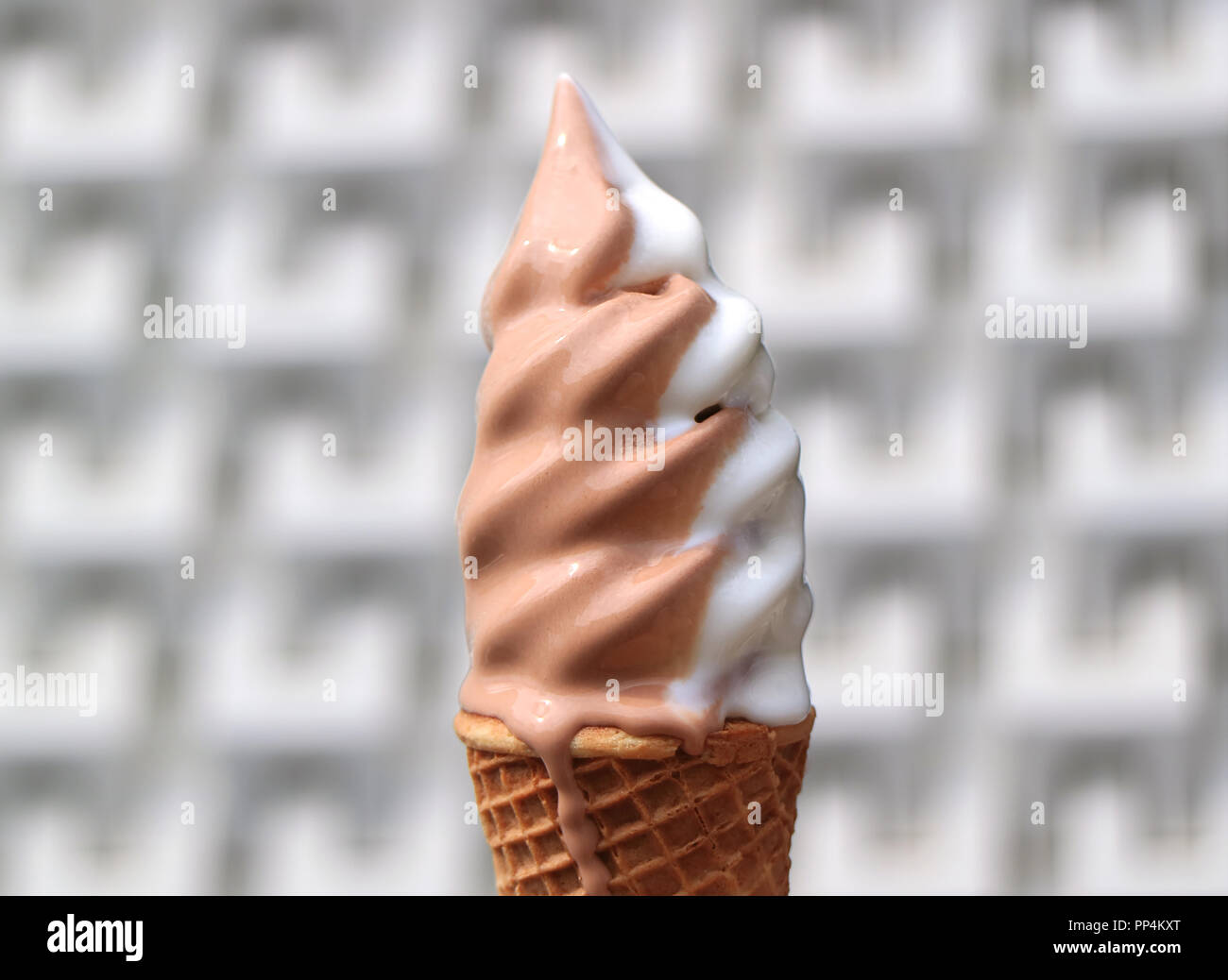 Melting Vanilla and Chocolate Flavors Soft Serve Ice Cream Cone with ...