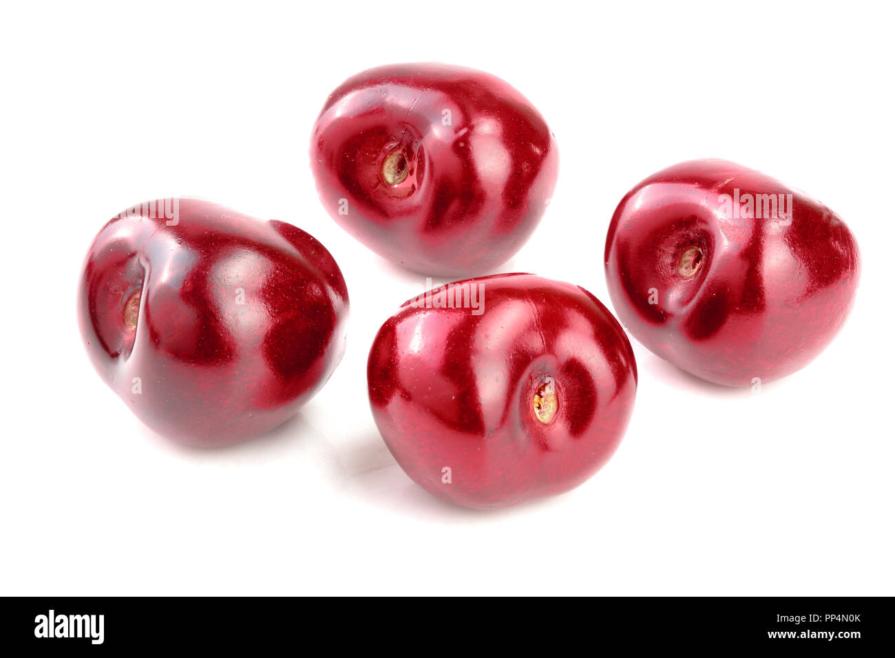 Sweet red cherries isolated on white background macro Stock Photo - Alamy