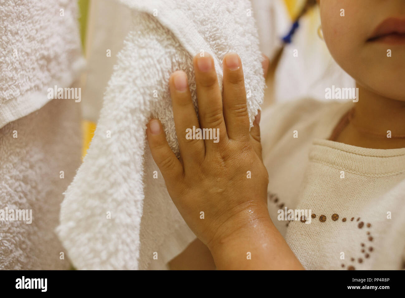 Child wipes hands towel hi-res stock photography and images - Alamy