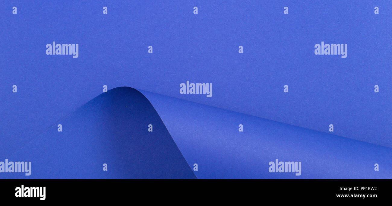 Abstract geometric shape blue color paper background Stock Photo - Alamy