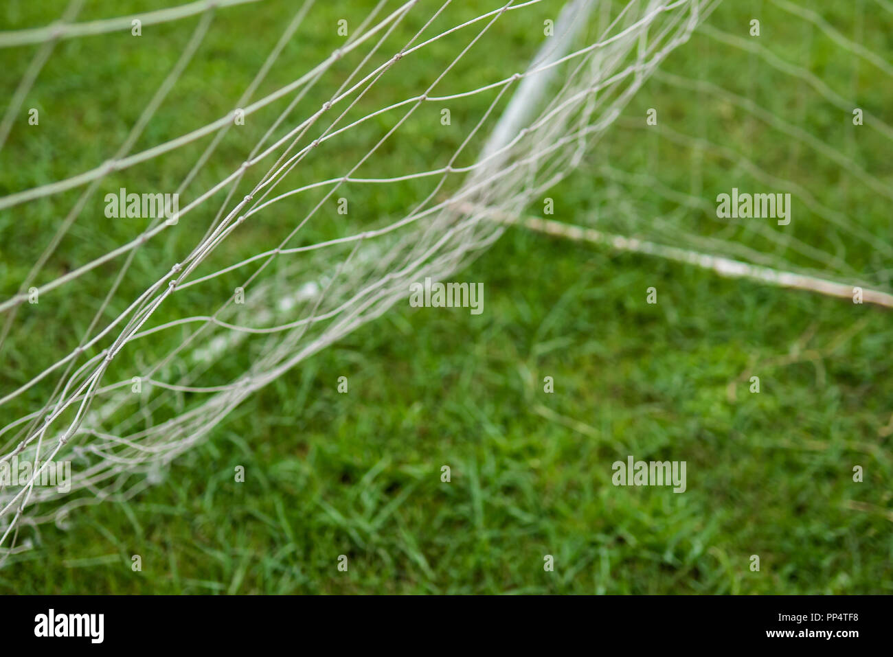 Soccer goal net with green field Stock Photo - Alamy
