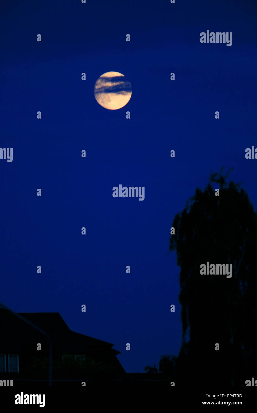 MOON with cloud veil Stock Photo - Alamy