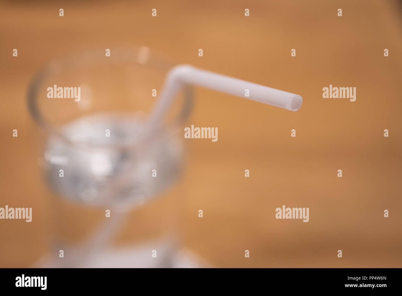 Straw in water glass Stock Photo - Alamy