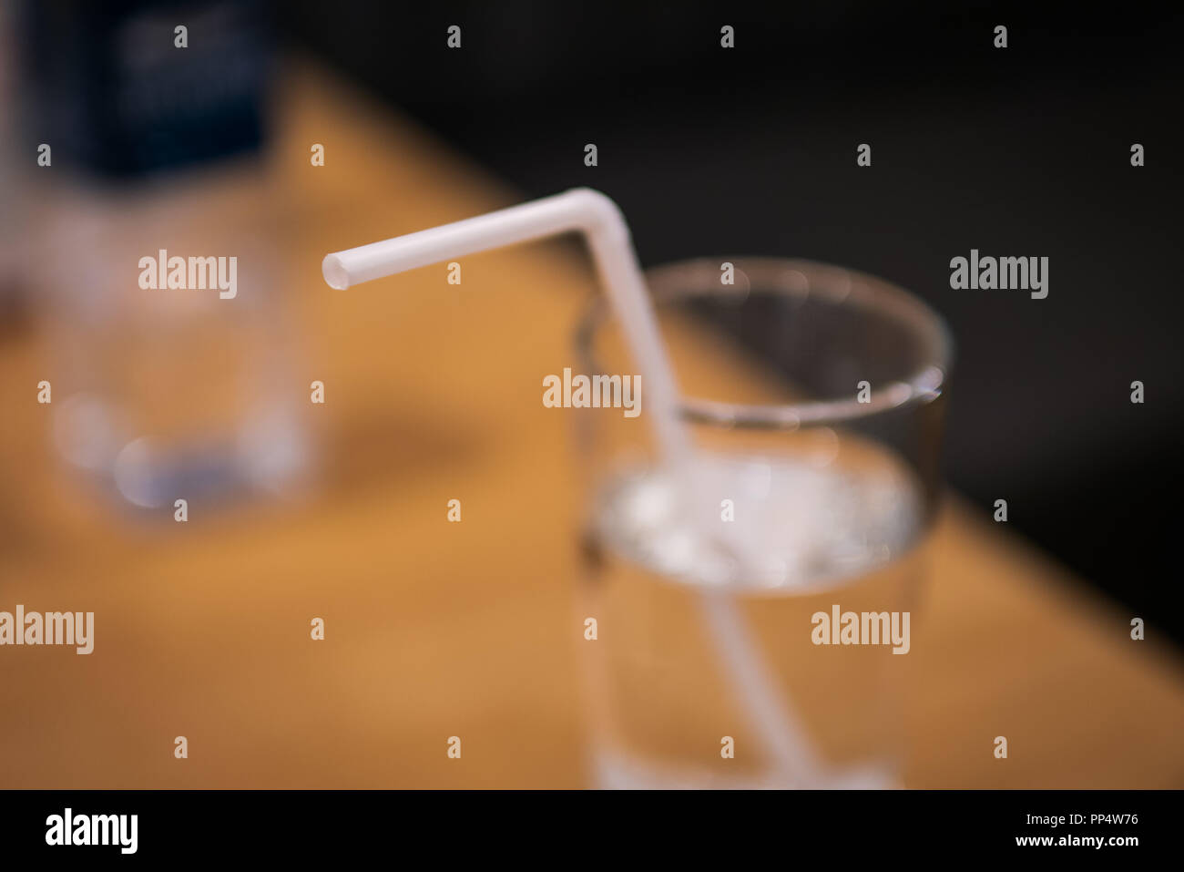 Straw in water glass Stock Photo - Alamy