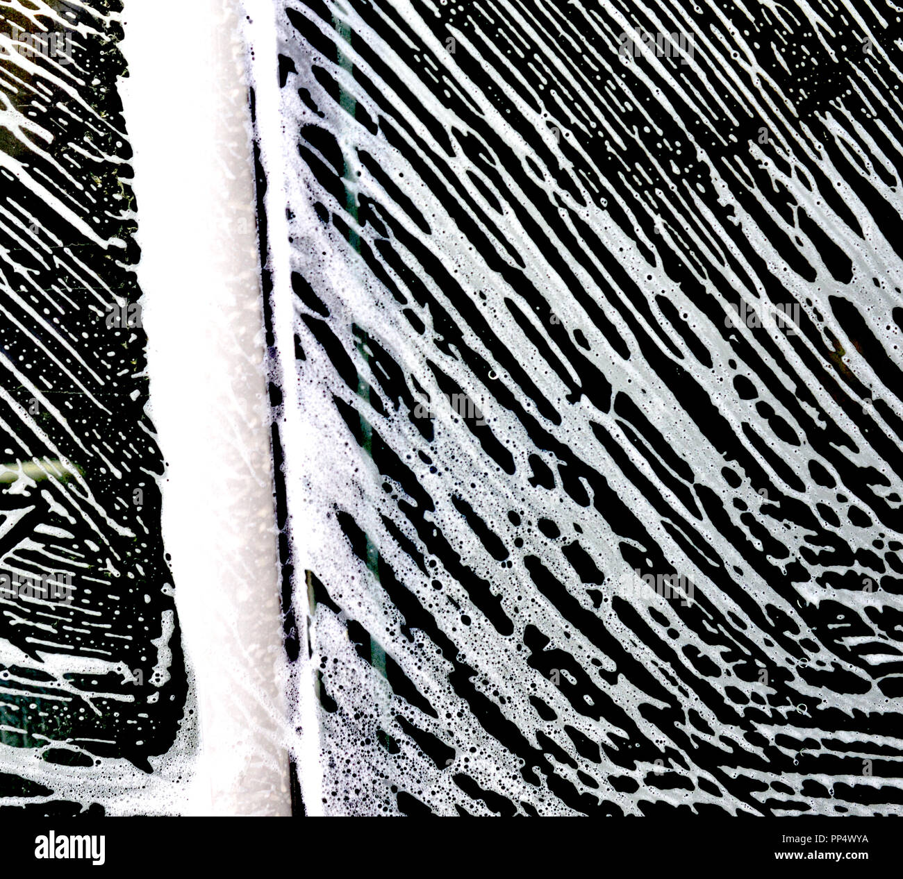 car wash foam patterns on a car window,image of a Stock Photo - Alamy