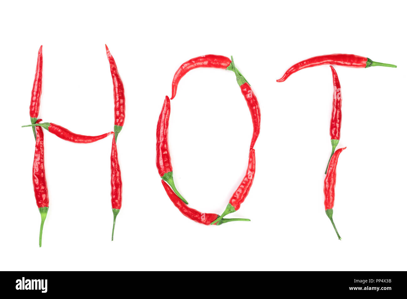 Word hot written from red pepper letters isolated on white background ...