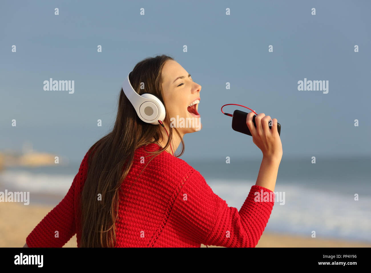 Female Singing Beach High Resolution Stock Photography and Images - Alamy