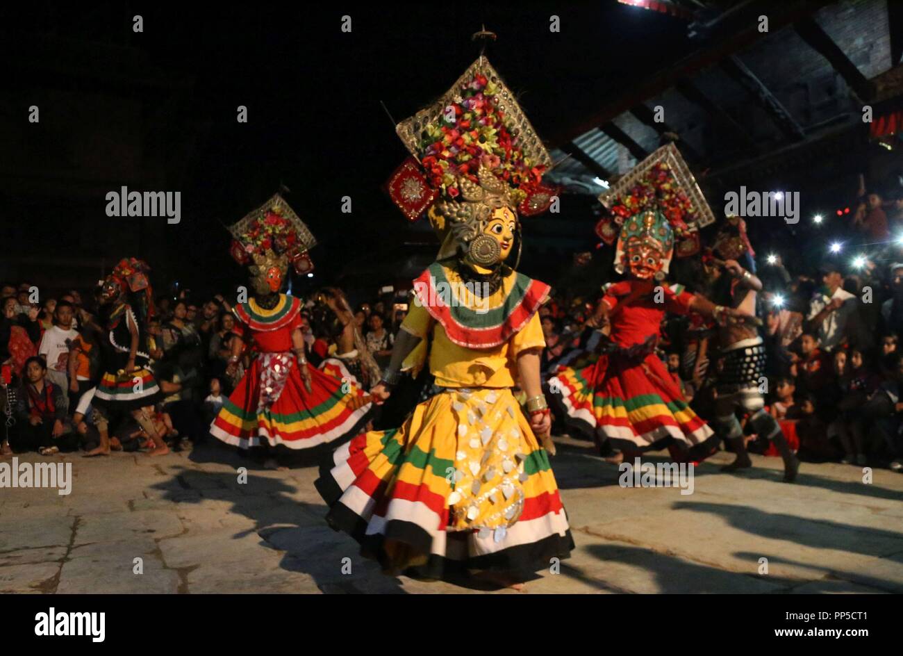 Kathmandu, Nepal. 22nd Sep, 2018. Masked dancers perform in celebration ...