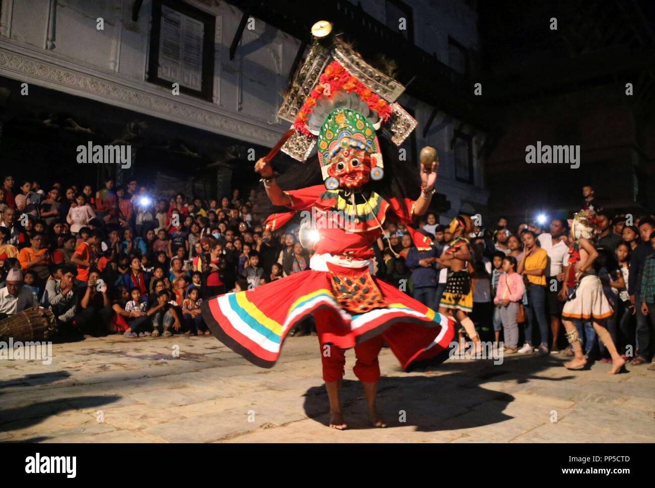 Kathmandu, Nepal. 22nd Sep, 2018. Masked dancers perform in celebration ...