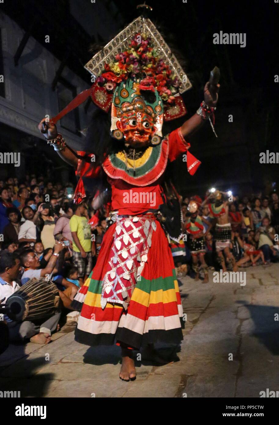 Kathmandu, Nepal. 22nd Sep, 2018. Masked dancers perform in celebration ...