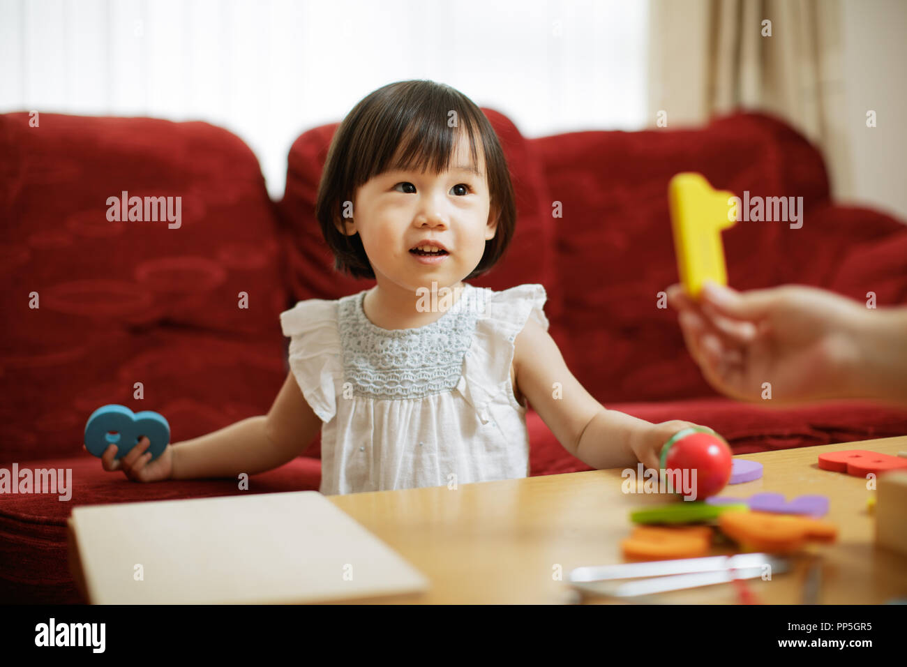 baby girl learning numbers at home Stock Photo - Alamy