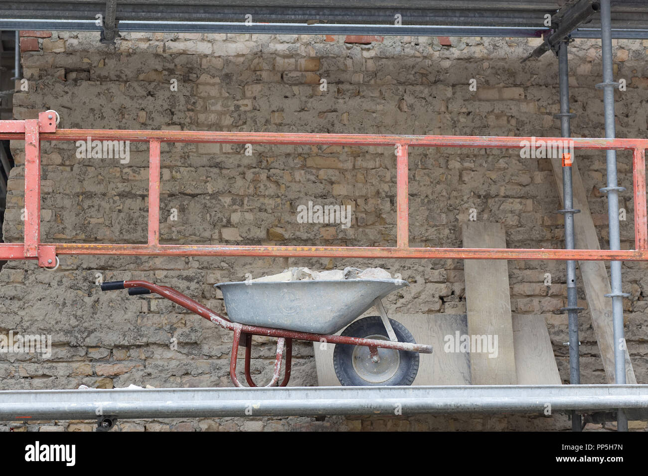 wheelbarrow on a platform of a construction site Stock Photo - Alamy