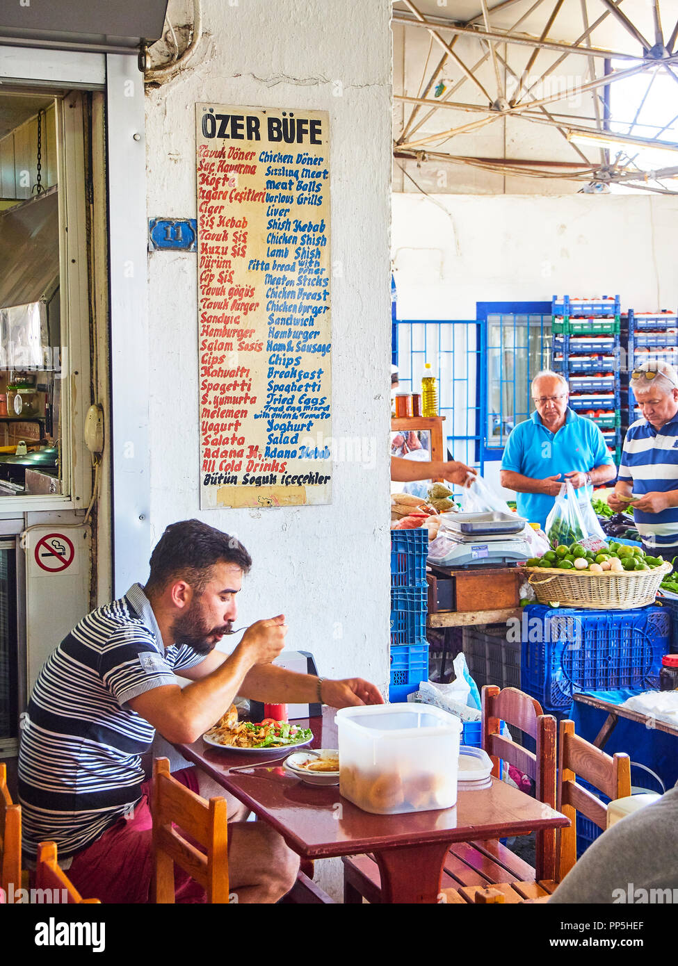 Bodrum, Turkey - July 6, 2018. A citizen eating in a Turkish tavern of ...