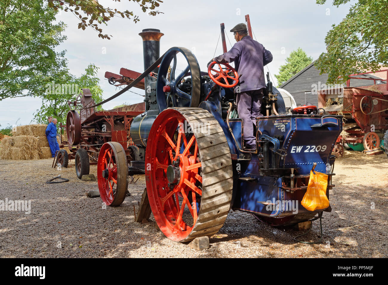 Vintage steam traction engine driving a straw baling machine Stock ...