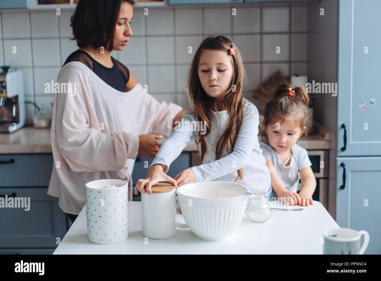 Happy family cook together in the kitchen Stock Photo - Alamy