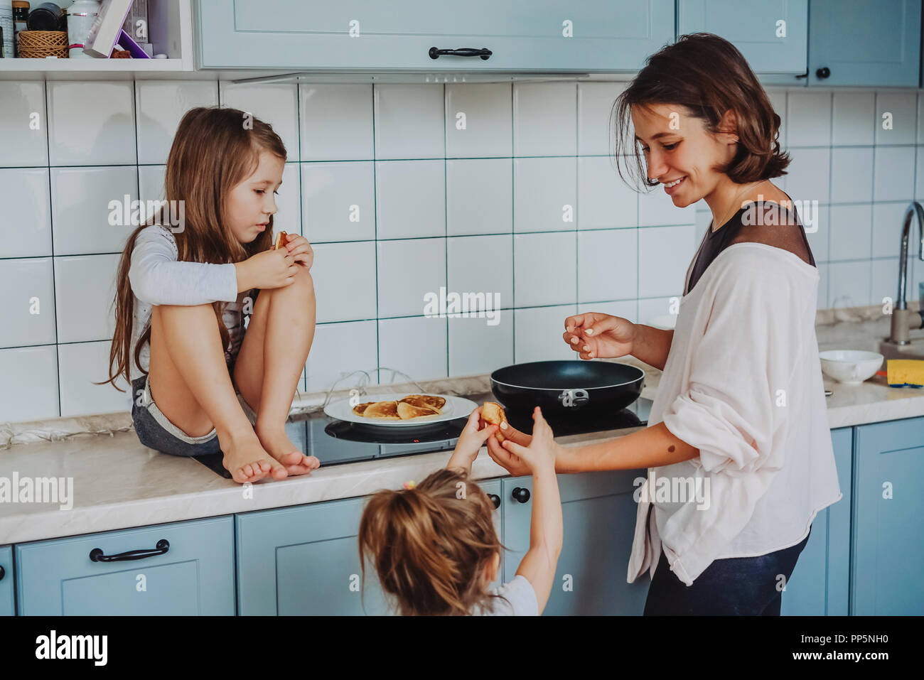 happy family cook together in the kitchen Stock Photo - Alamy