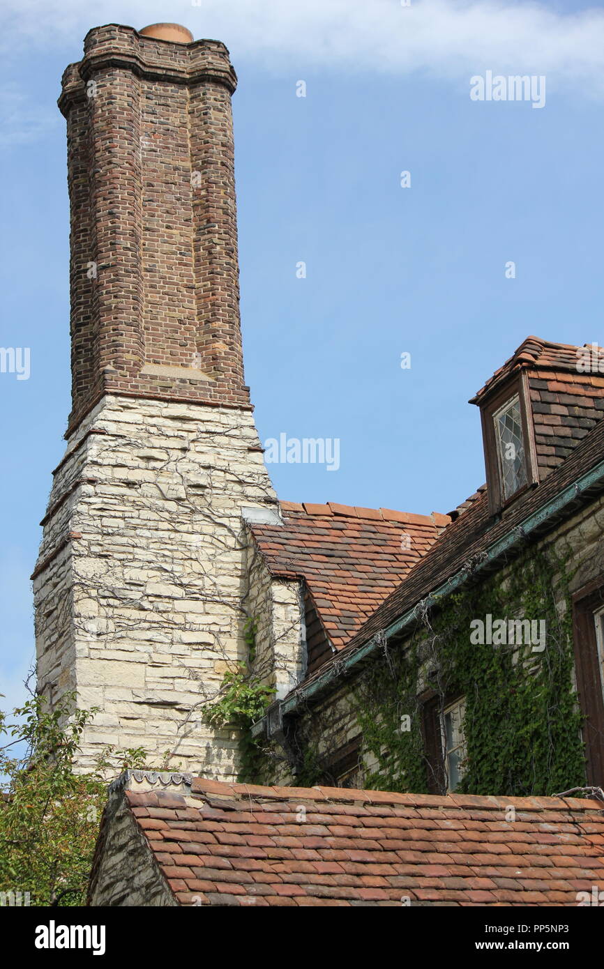 Fancy fireplace chimney and residential home and weathered old ...