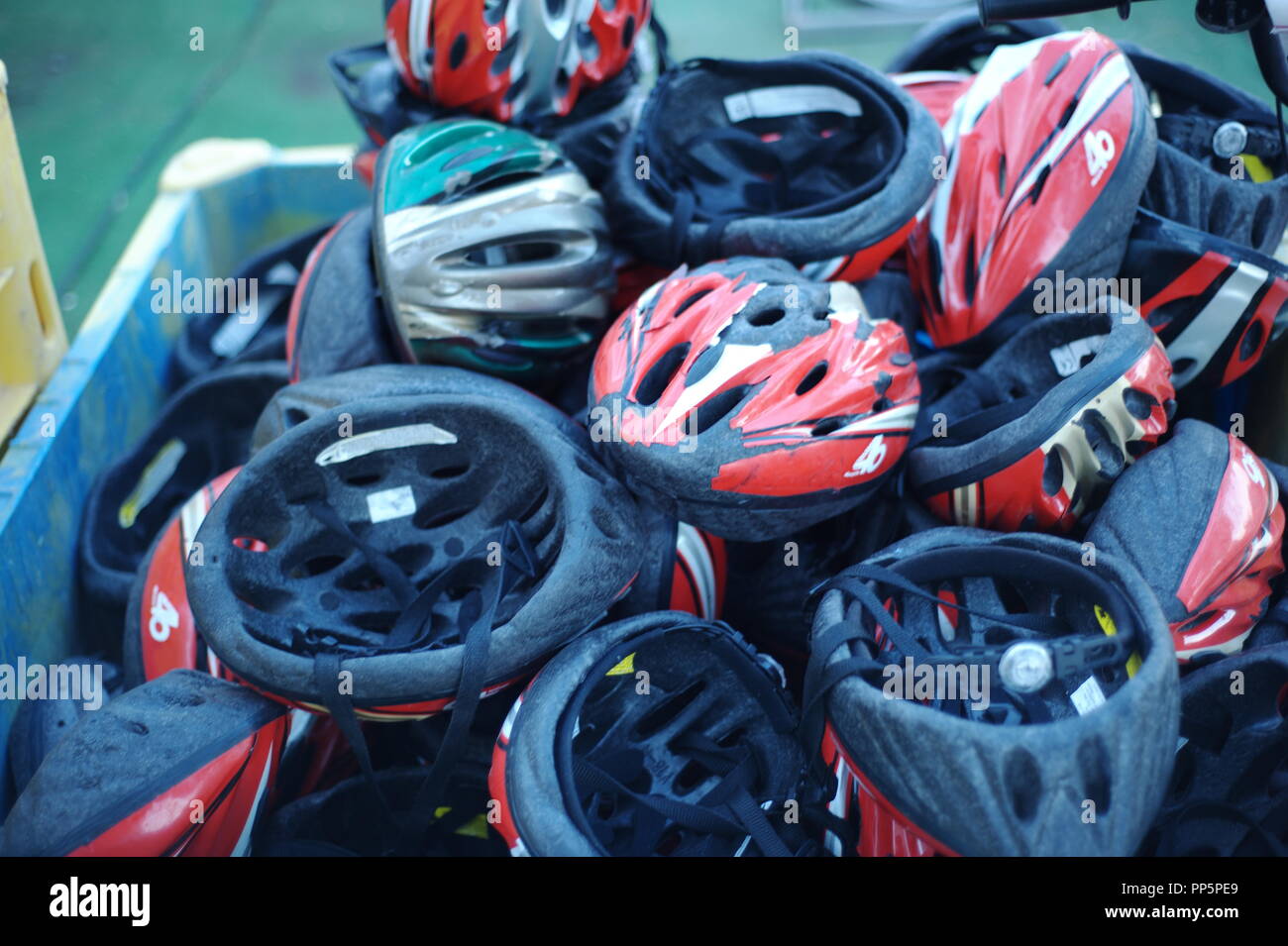 a pile of helmets , in box, ridding safety Stock Photo - Alamy