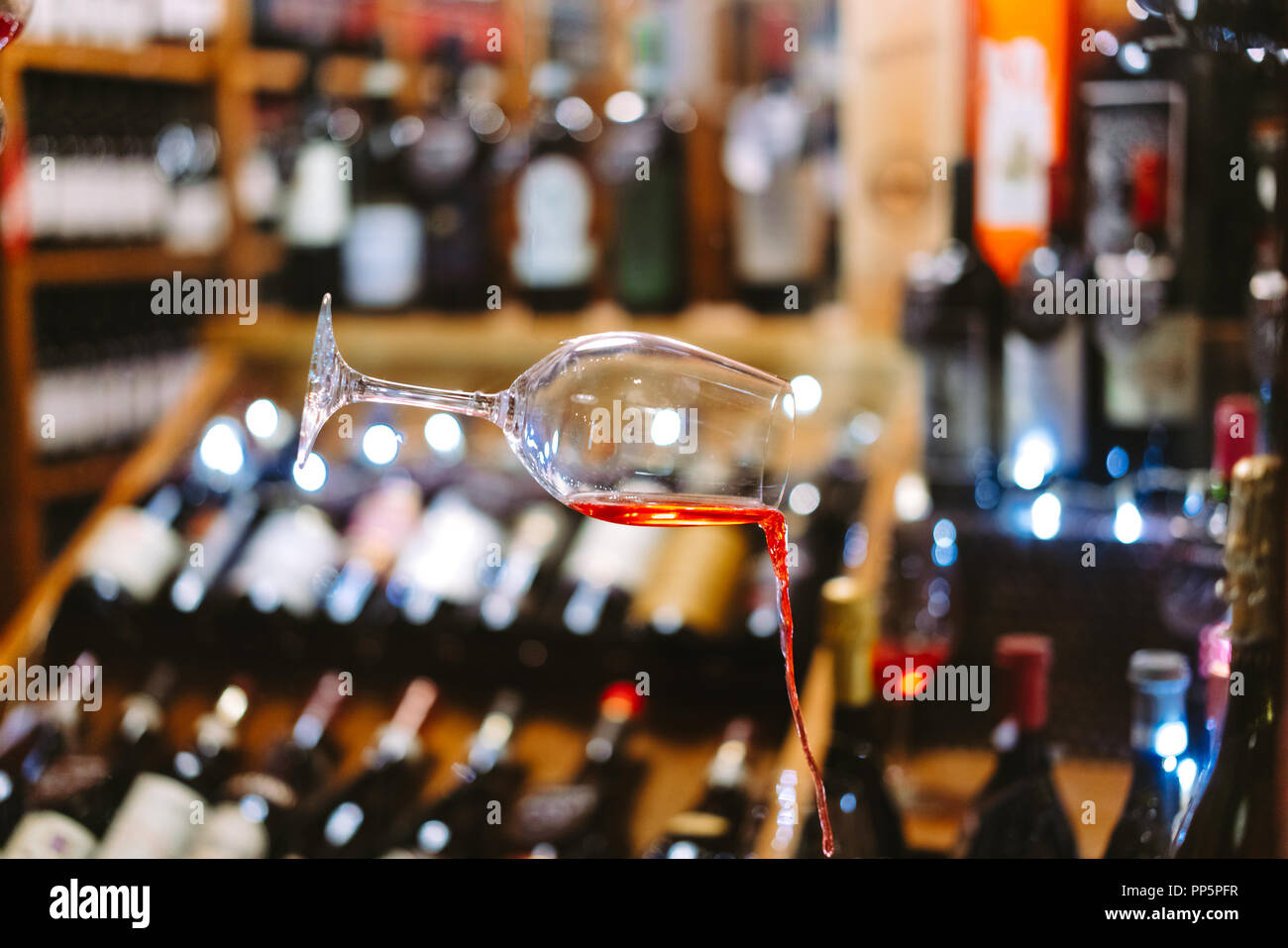 Glass of Wine Falling Mid Air with Spill Stock Photo - Alamy