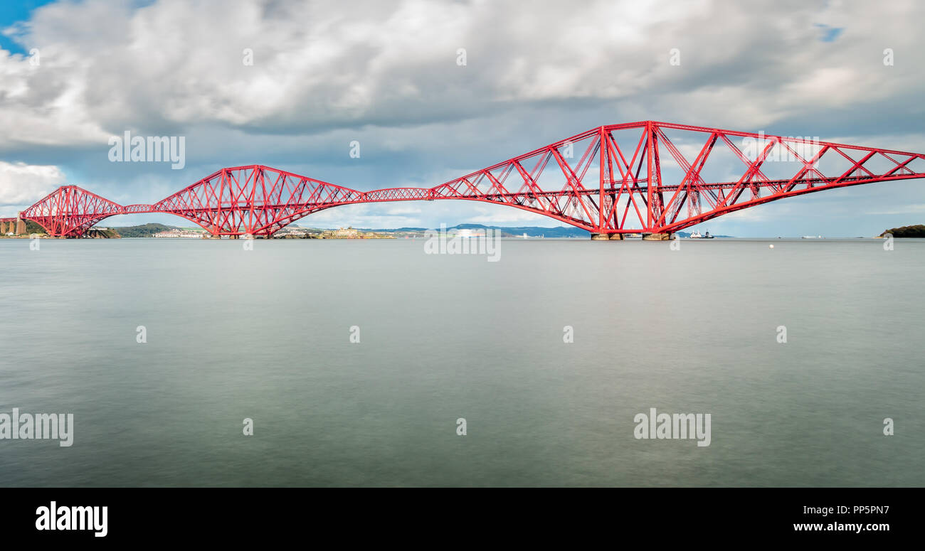 Long exposure shot of the train bridge at forth of fifth on a nice cloudy day Stock Photo - Alamy