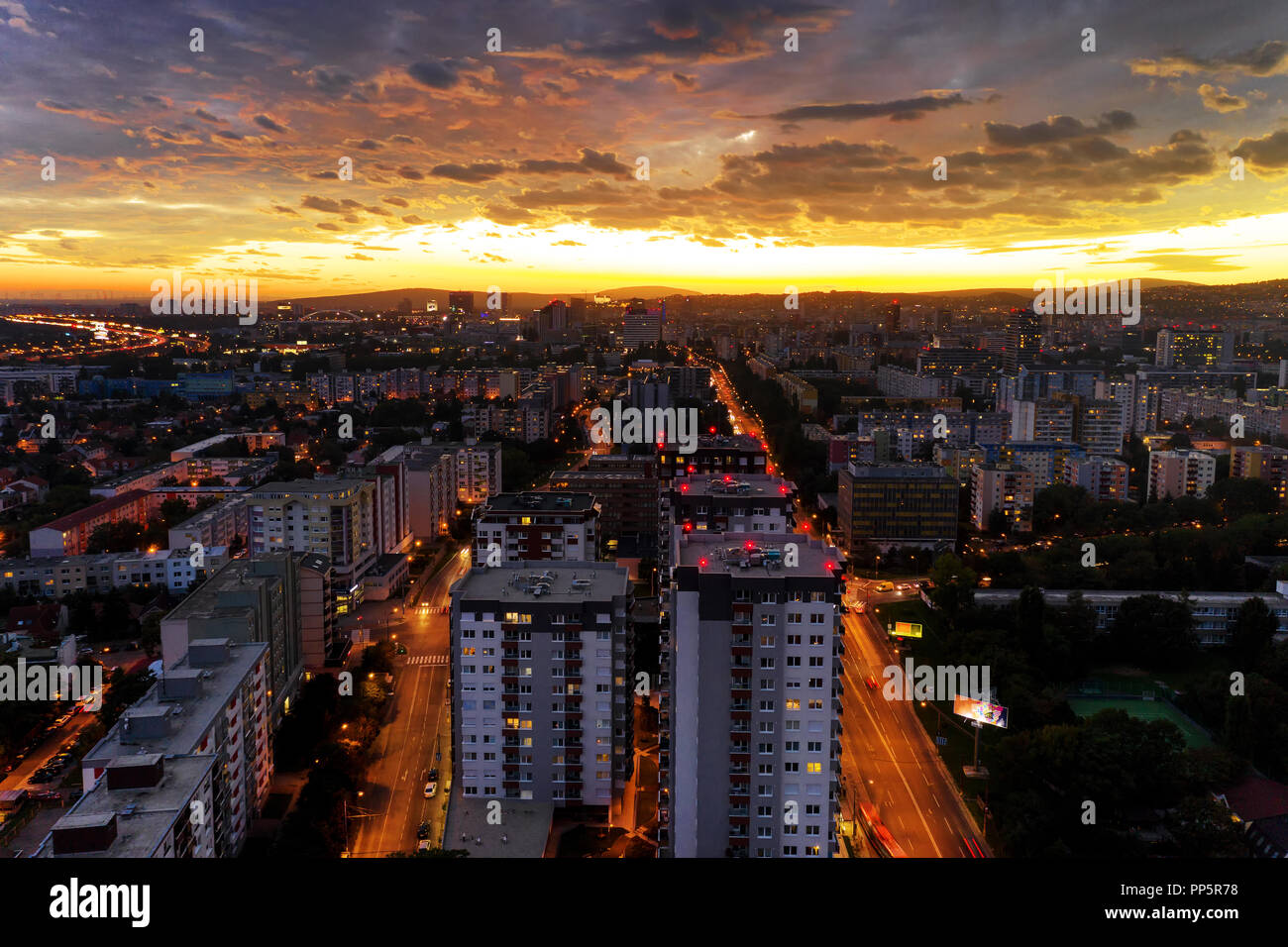 Aerial view of cityscape at evening with beautiful sunset Stock Photo ...