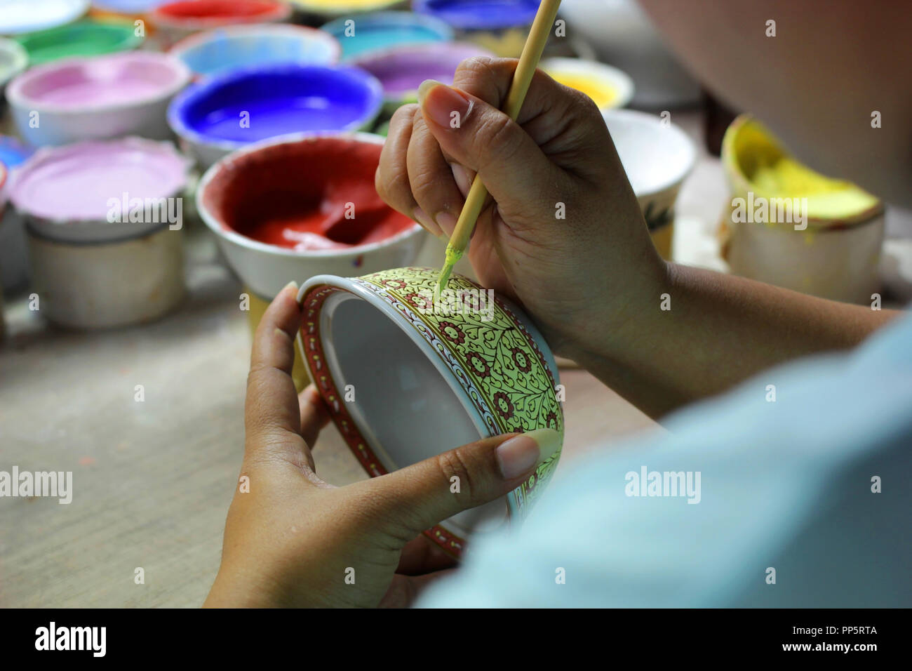 artist painting benjarong ceramic ware , A traditional Thai five ...