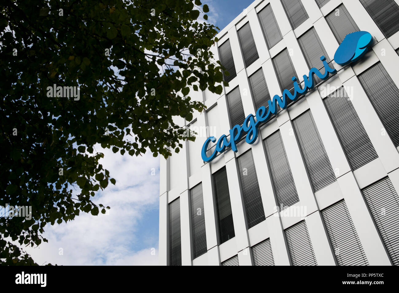 A logo sign outside of a facility occupied by Capgemini in Munich ...