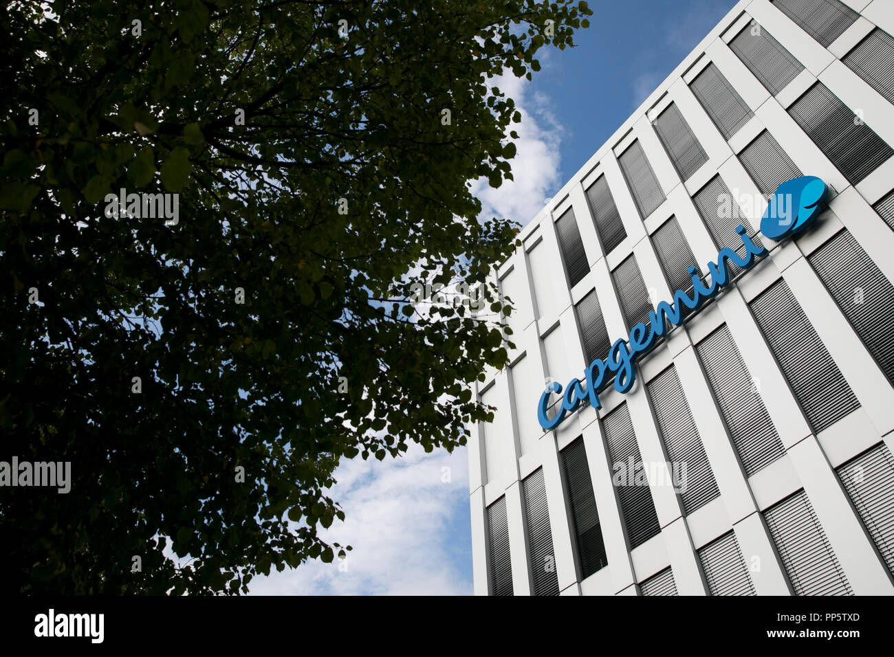 A logo sign outside of a facility occupied by Capgemini in Munich ...