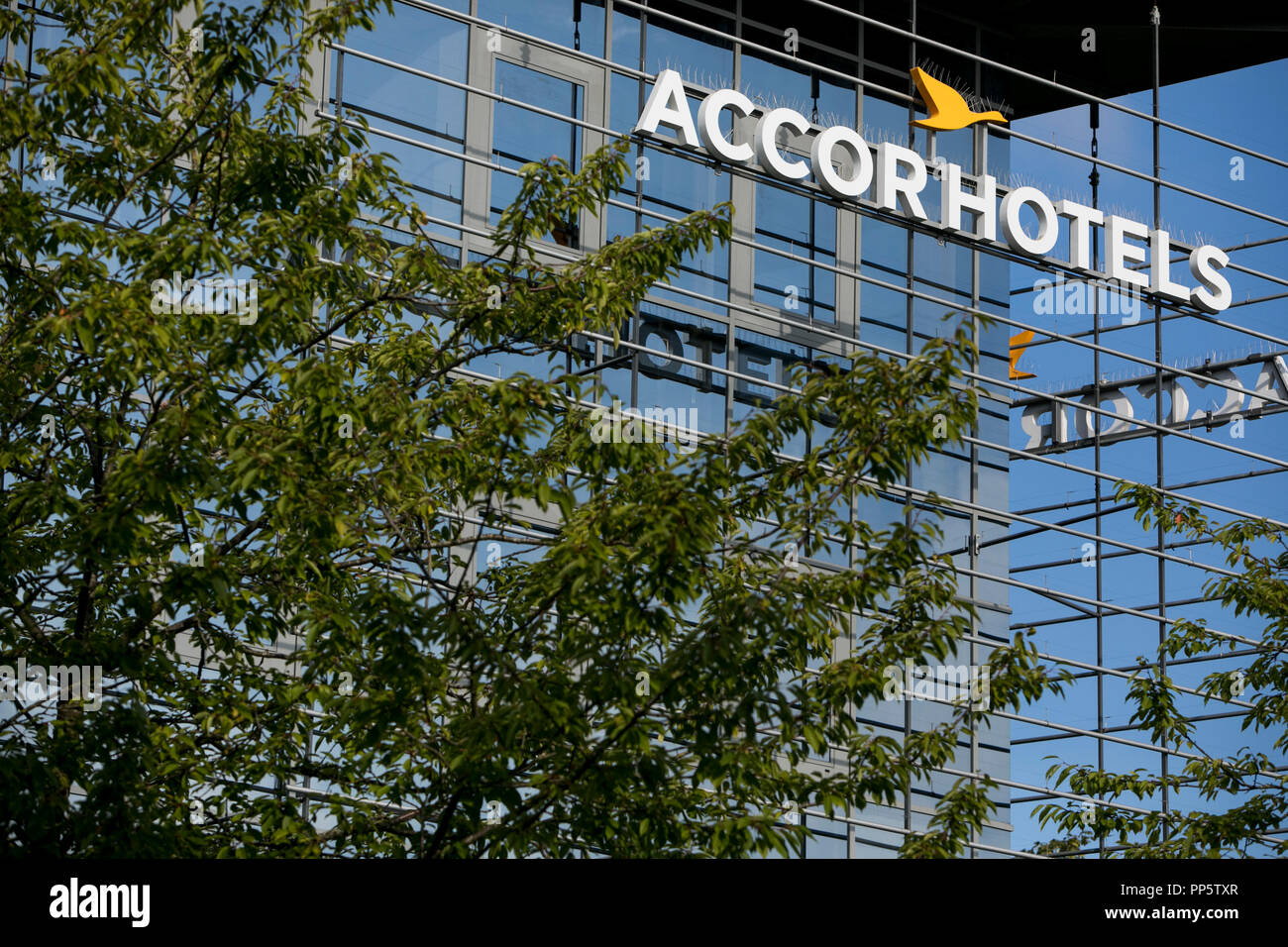 A logo sign outside of a facility occupied by AccorHotels in Munich ...