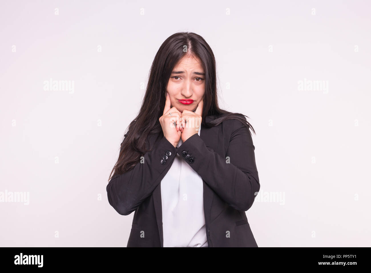 Joking asian girl with funny face in white background Stock Photo - Alamy