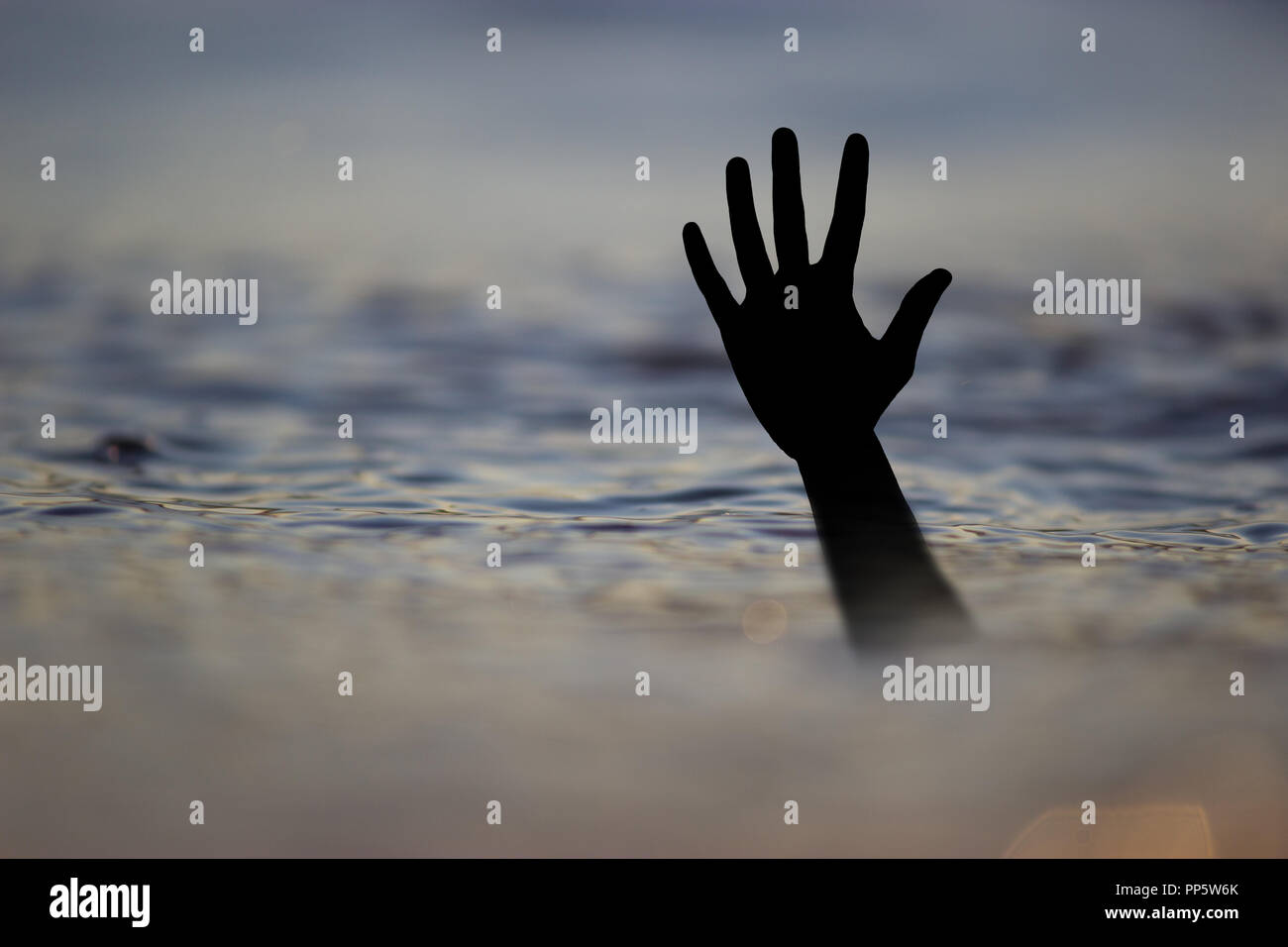 Drowning victims, Hand of drowning man needing help Stock Photo - Alamy