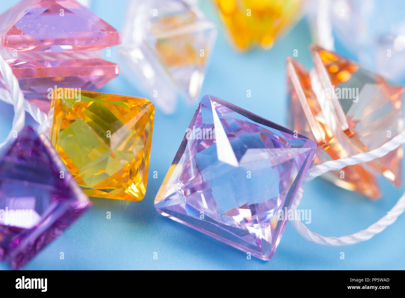 colorful jewellery on the blue background Stock Photo - Alamy