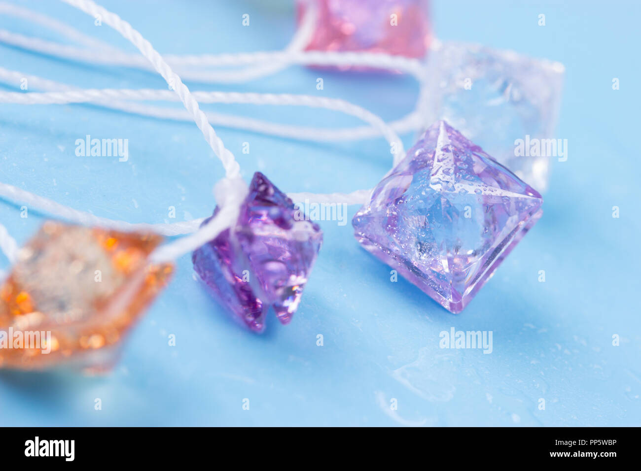 colorful jewellery on the blue background Stock Photo - Alamy