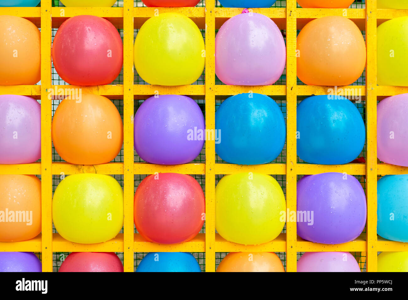 Inflatable balls in square shelves Stock Photo - Alamy