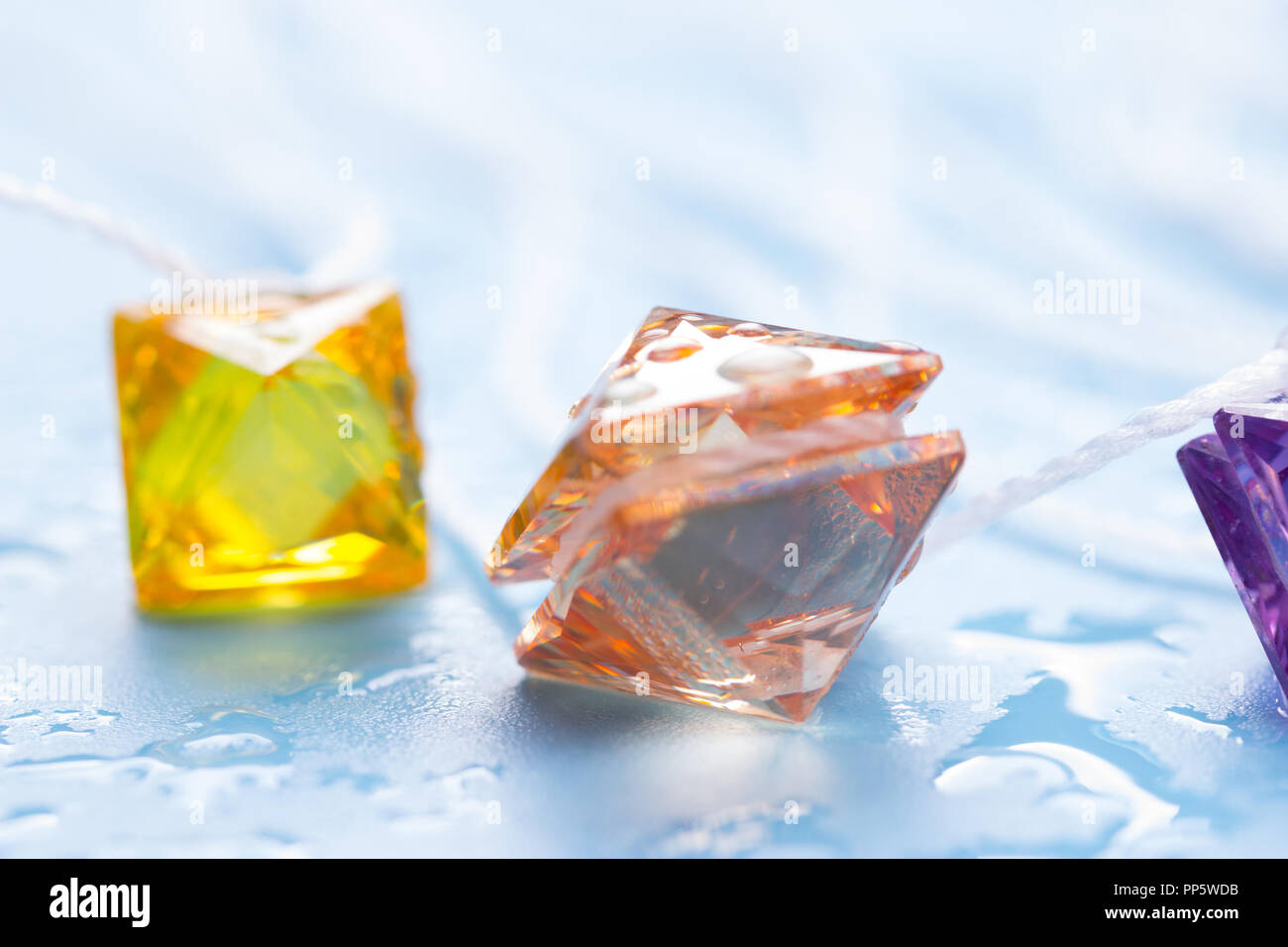 colorful jewellery on the blue background Stock Photo - Alamy